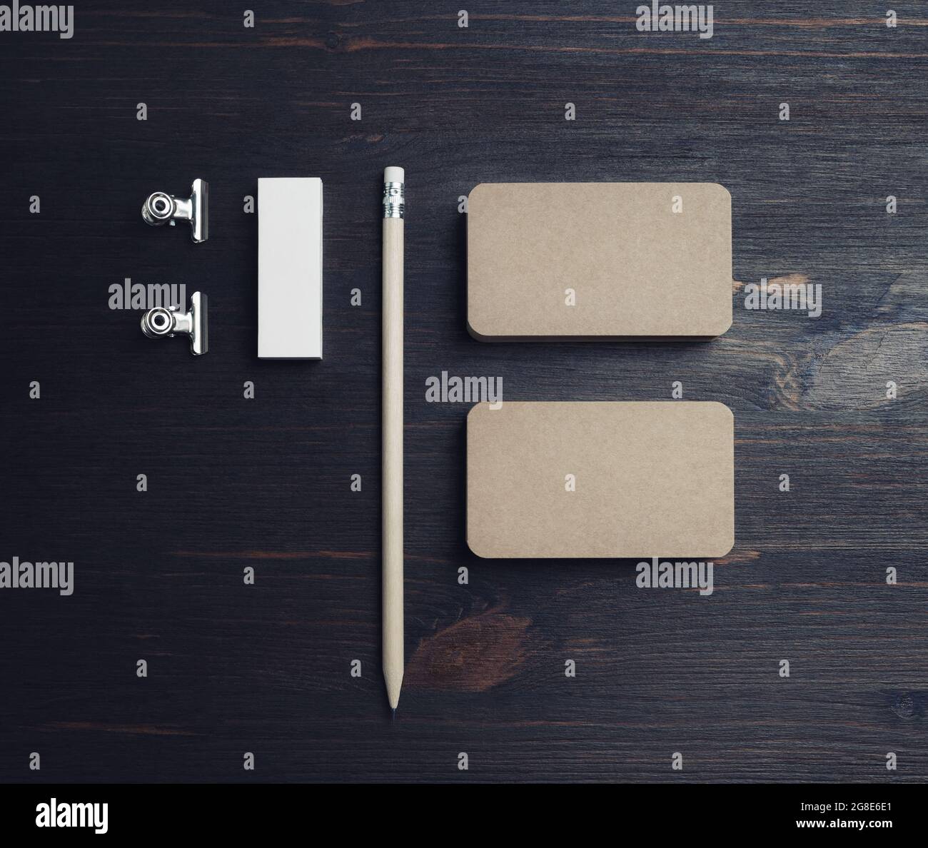 Blank stationery set. Kraft business cards, pencil and eraser on wooden ...