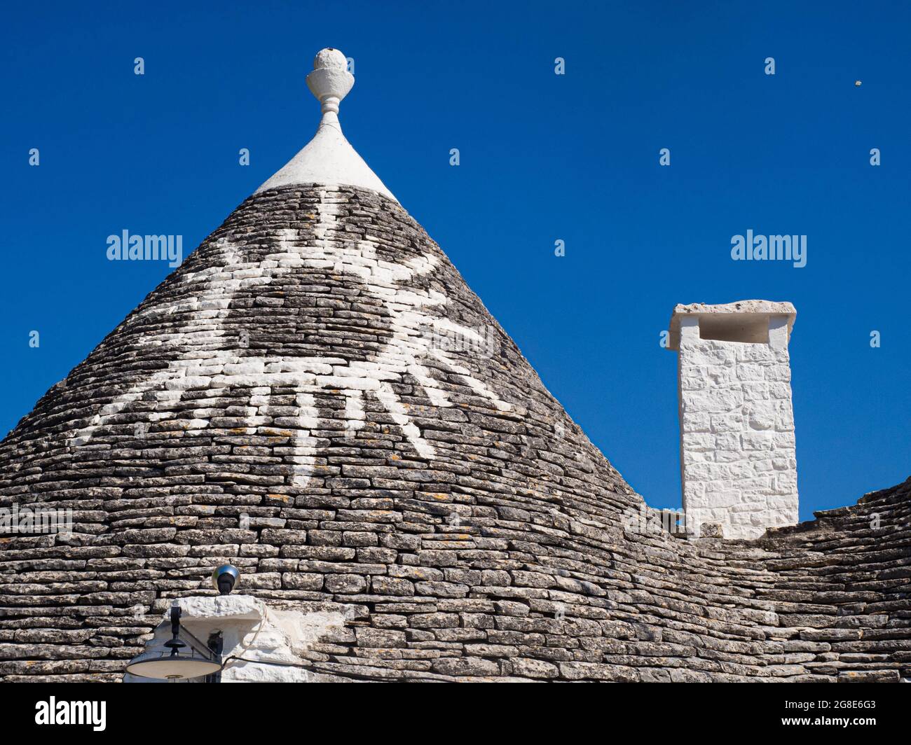 Round slate roof with sun, Trulli house, Monti district, Alberobello ...