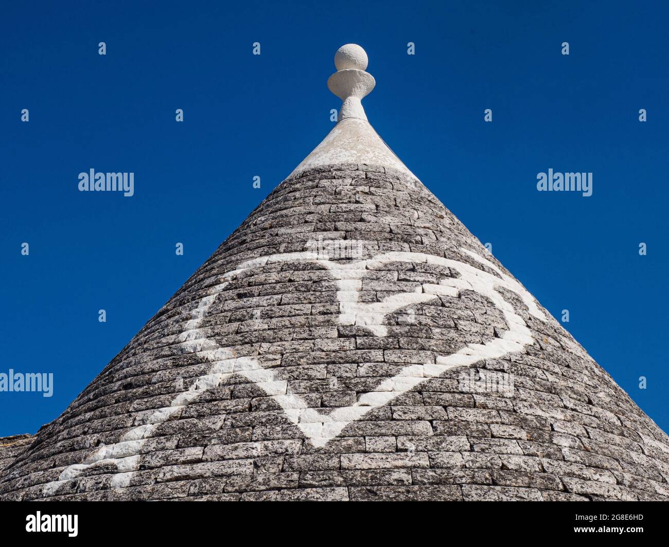 Round slate roof with heart, Trulli house, Monti district, Alberobello ...