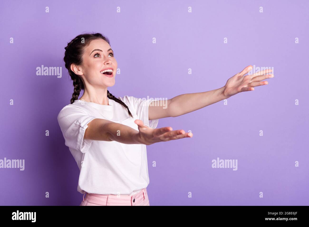Profile portrait of charming cheerful person raise arms look interested ...