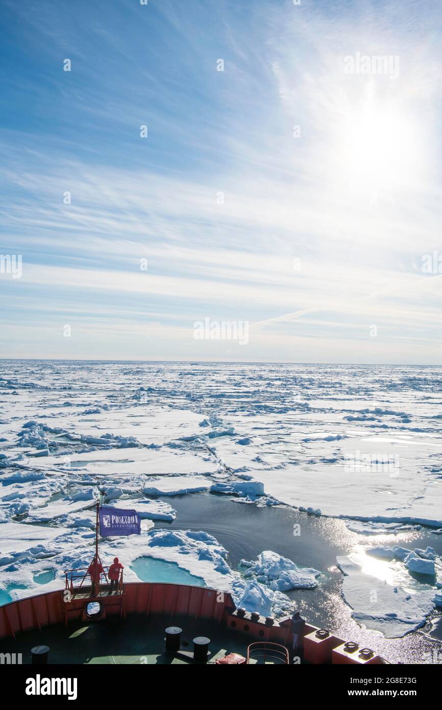 People enjoying the breaking ice on board of an icebreaker, North Pole ...