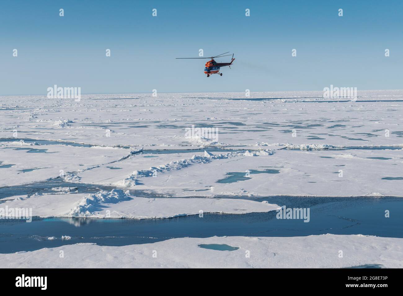 Helicopter in the air flying above the ice of the Arctic, Arctic Stock ...