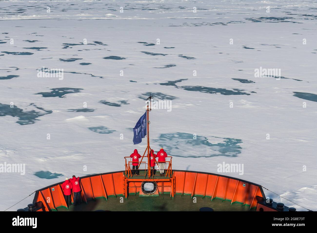 Tourists watching the ice breaking on board of an icebreaker, North ...