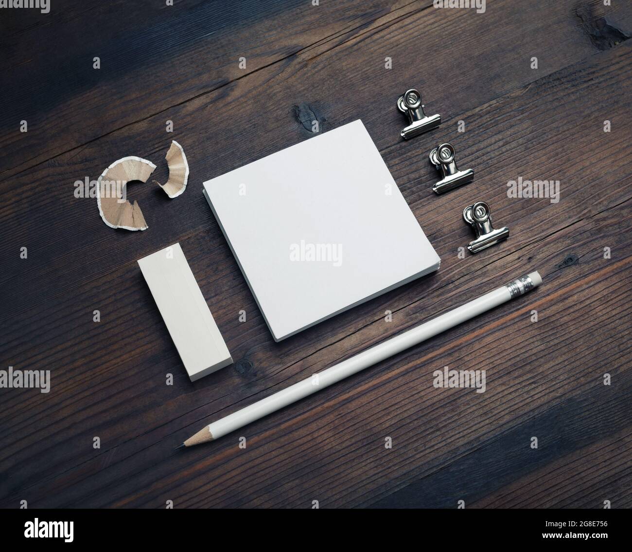 White square notes, pencil and eraser on wood table background. Blank ...