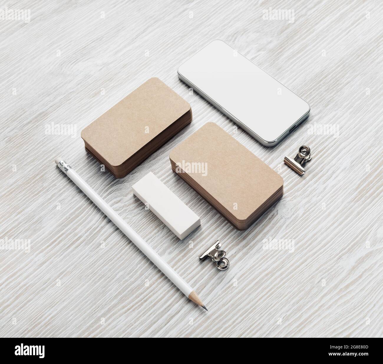 Smartphone and blank stationery set: kraft business cards, pencil and ...
