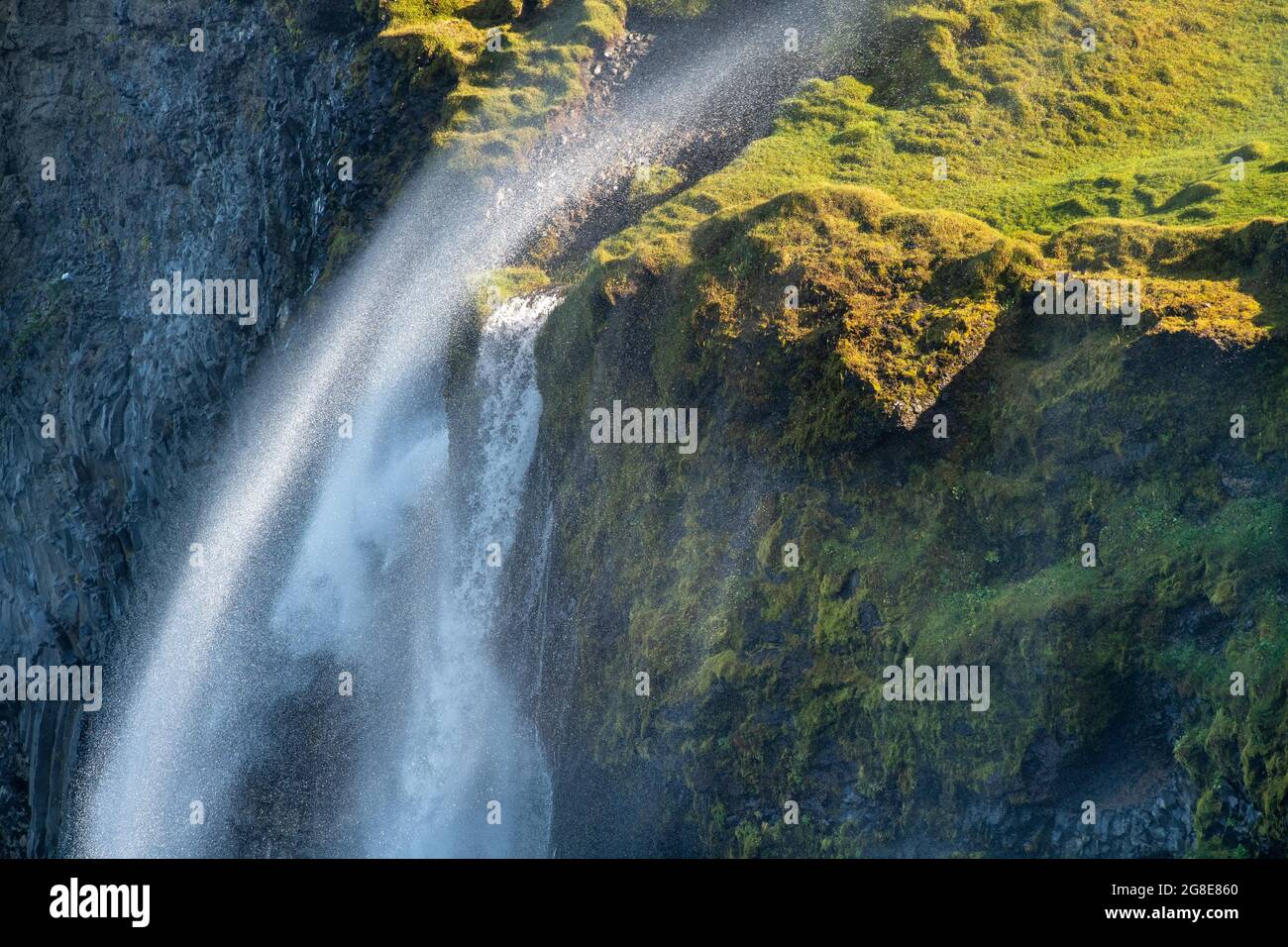 Waterfall falls over cliff and is blown away by wind, Skagi Peninsula ...