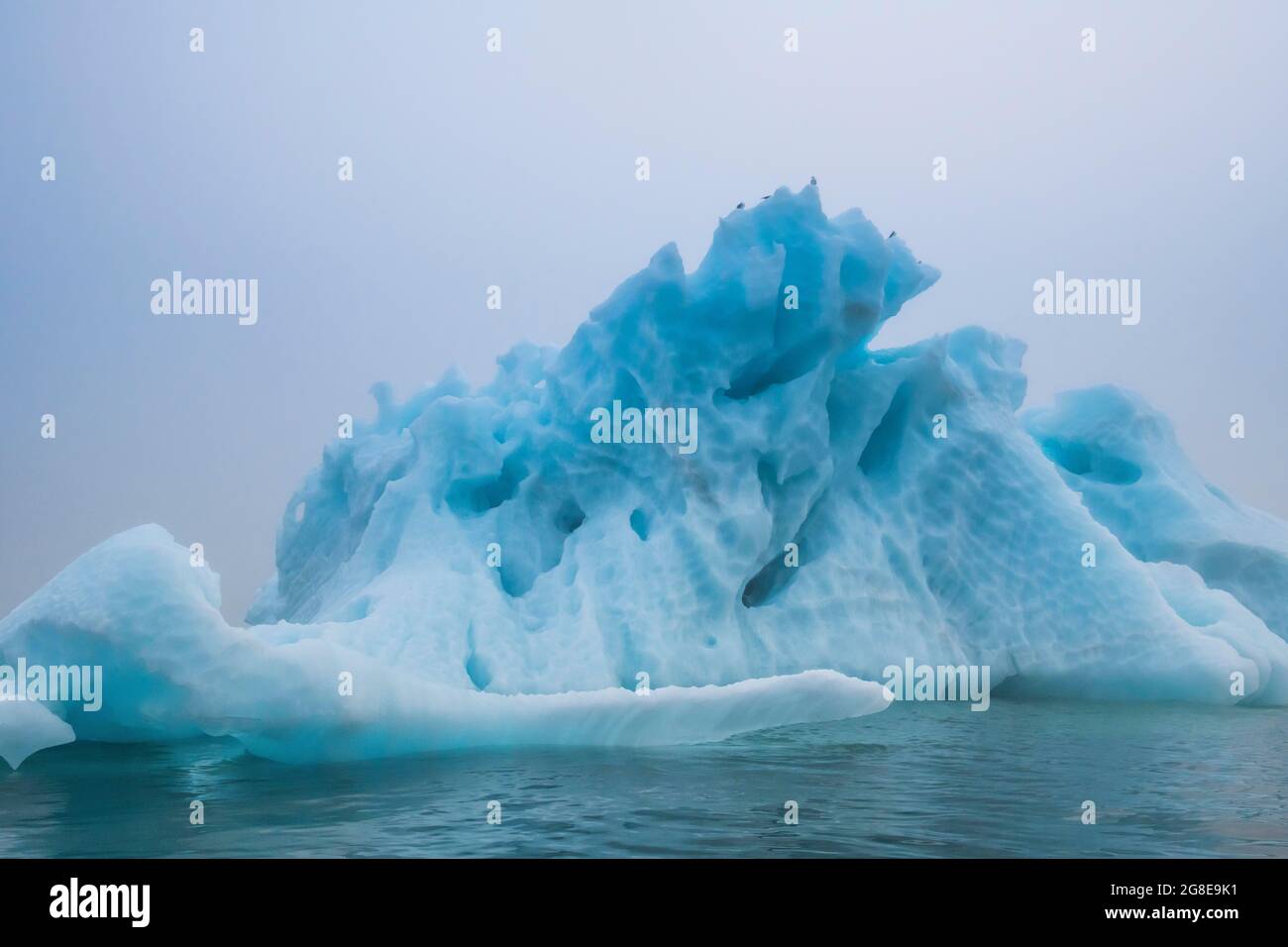 Incredible shaped iceberg shining blue, Franz Josef Land archipelago ...