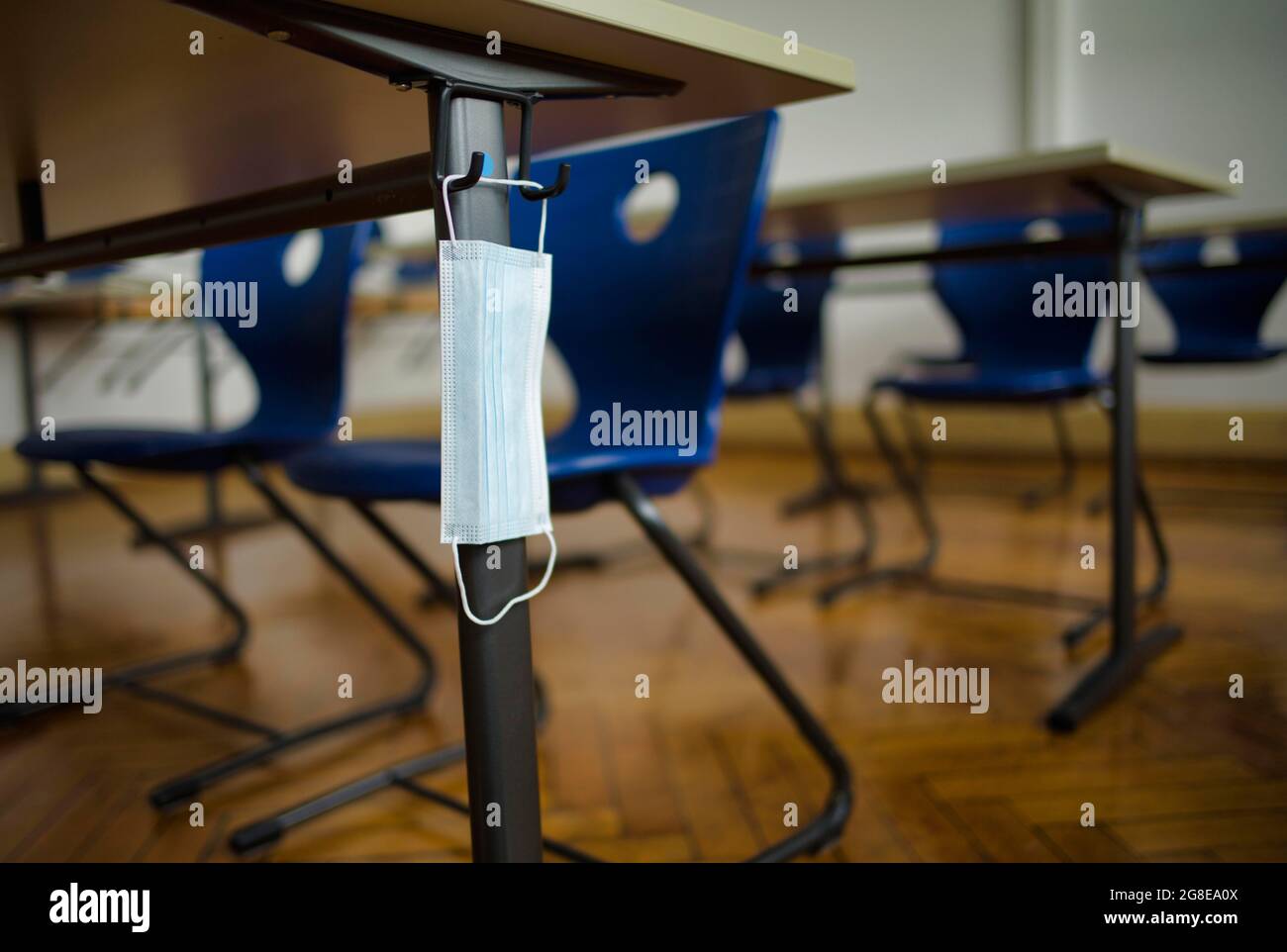 Mouth mask hangs on student's desk, classroom teaching, Corona crisis ...