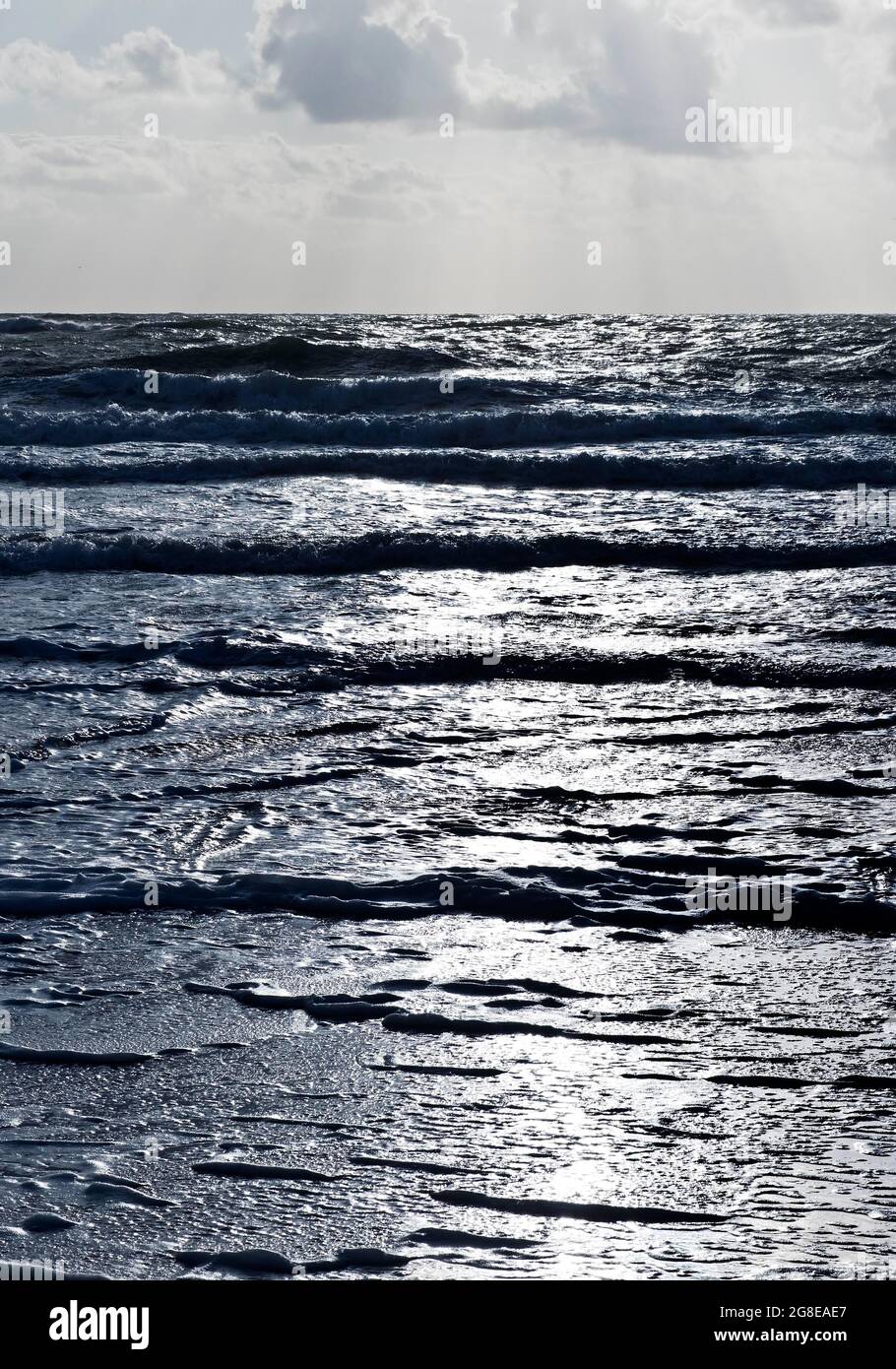 North Sea with outgoing waves in backlight, west coast Hoernum, Sylt ...