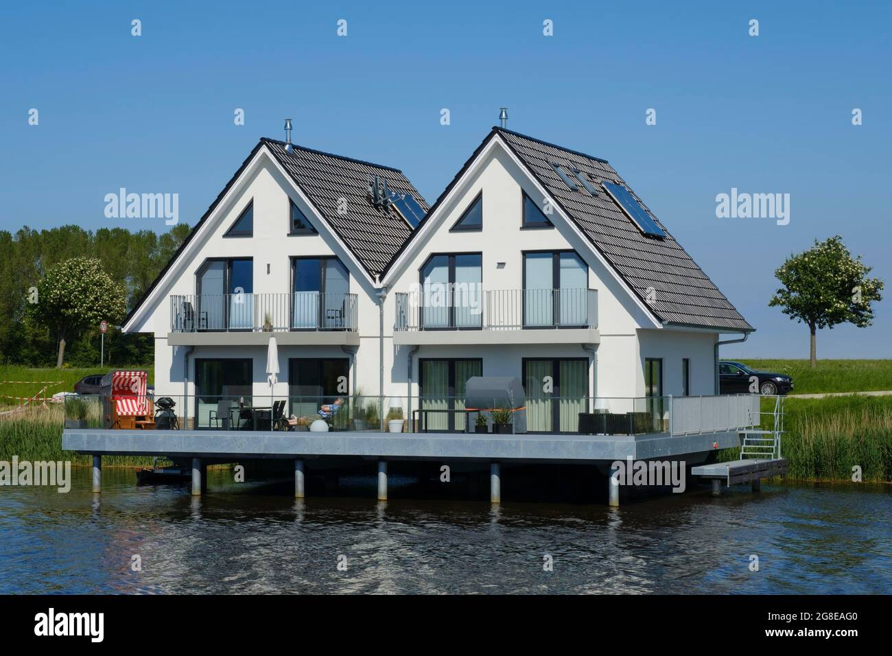 Pile houses on the river Harle, Harlesiel, Carolinensiel, East Frisia ...
