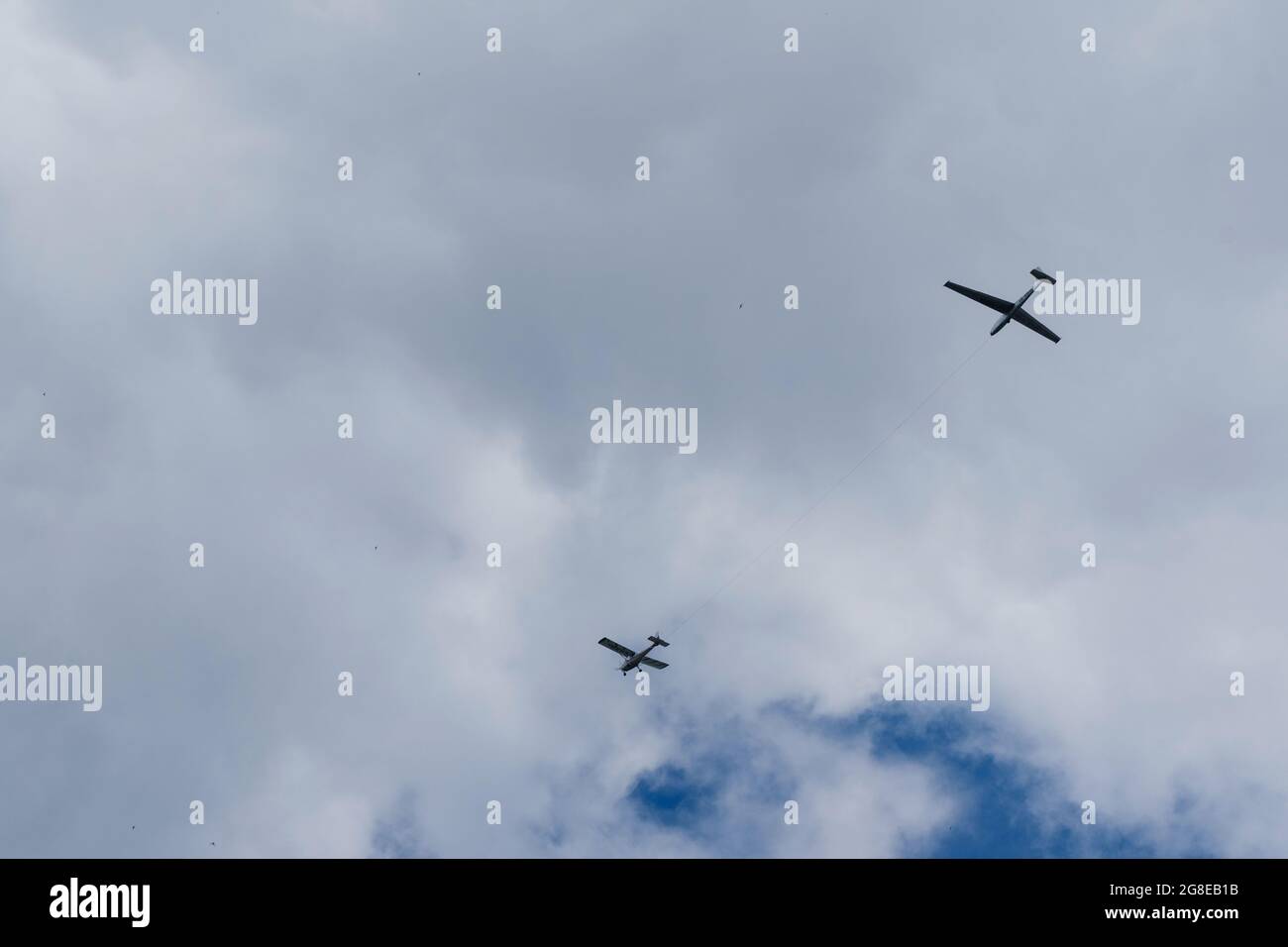 Glider planes flying in the sky. Extreme active sport. Cloudy blue sky ...