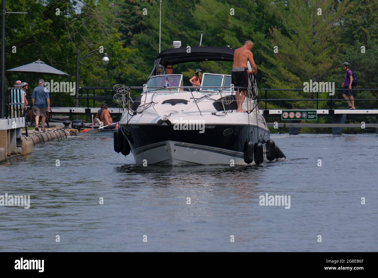 small Yacht boat coming out of the Hartwells Locks on Rideau Canal, in ...