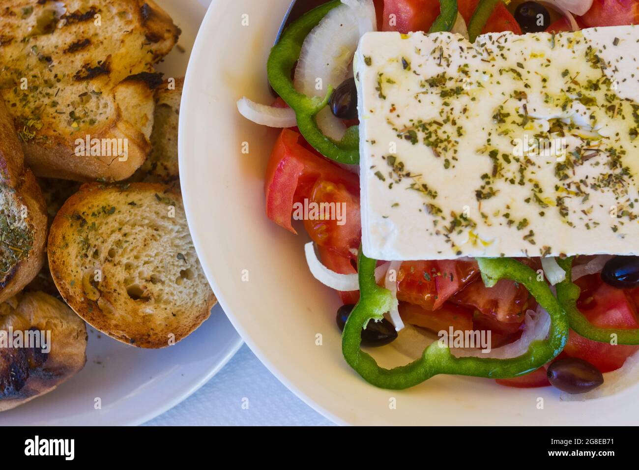 A traditional Greek salad with Garlic bread at a restaurant on Crete ...