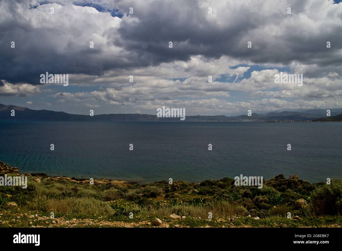 A view across the sea from a peninsula on the island of Crete, Greece ...