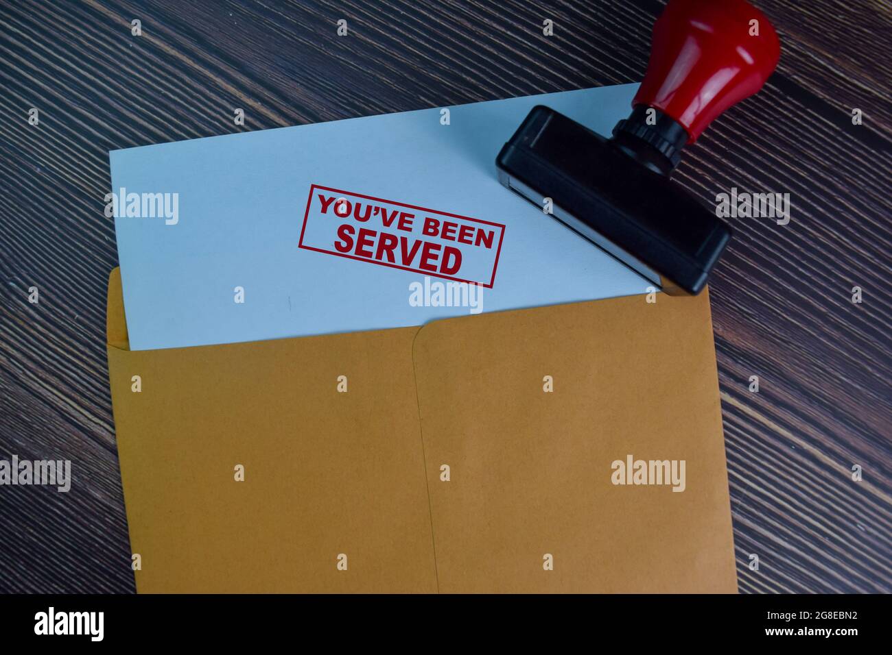 You've Been Served text on document above brown envelope Stock Photo ...
