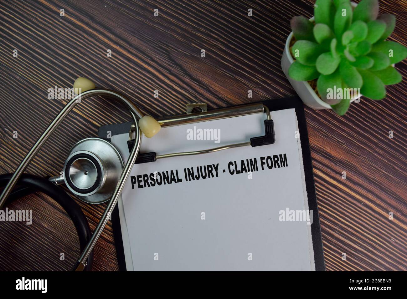 Personal Injury - Claim Form write on a paperwork isolated on Wooden ...