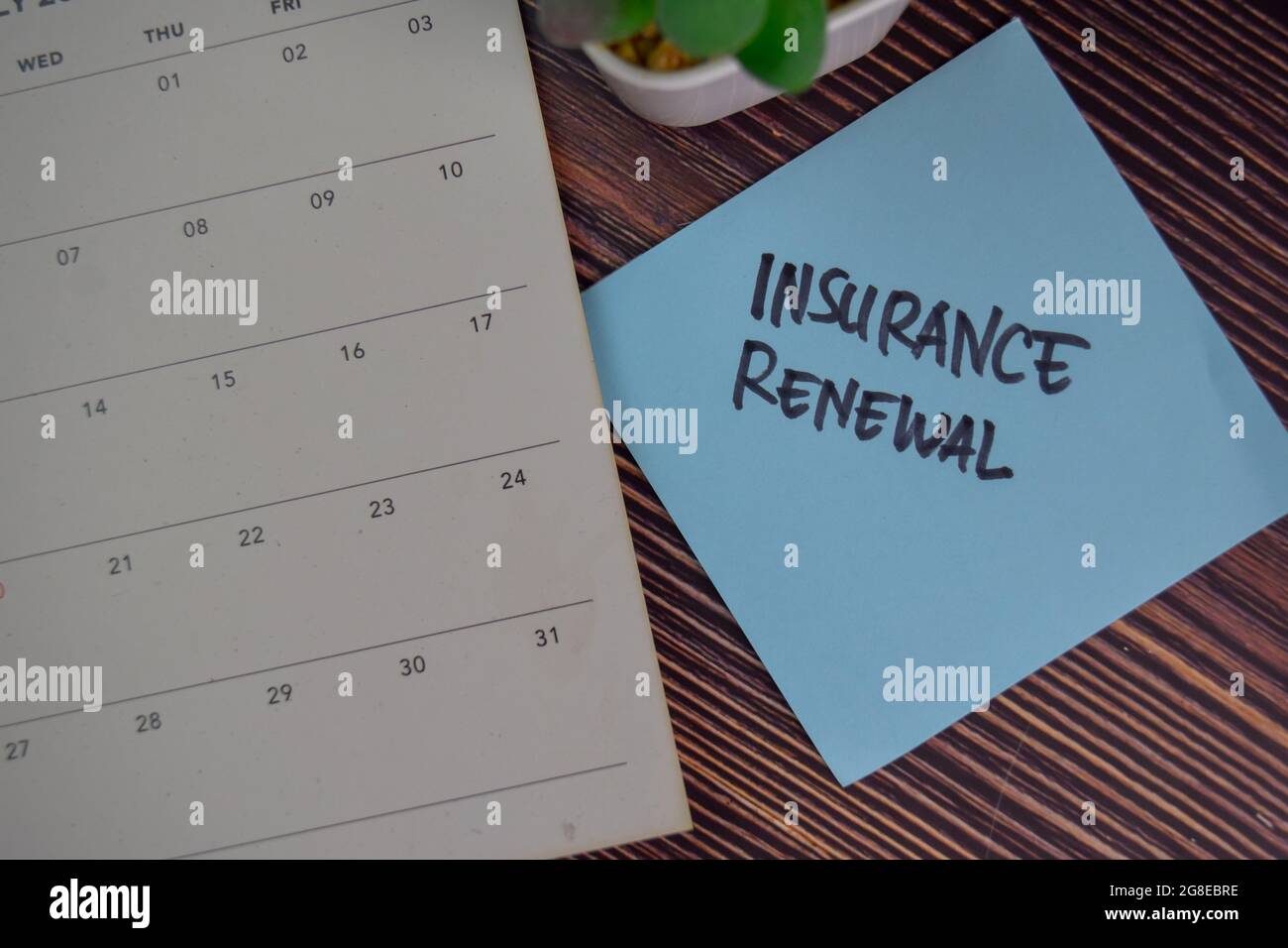 Insurance Renewal write on sticky notes isolated on Wooden Table Stock ...