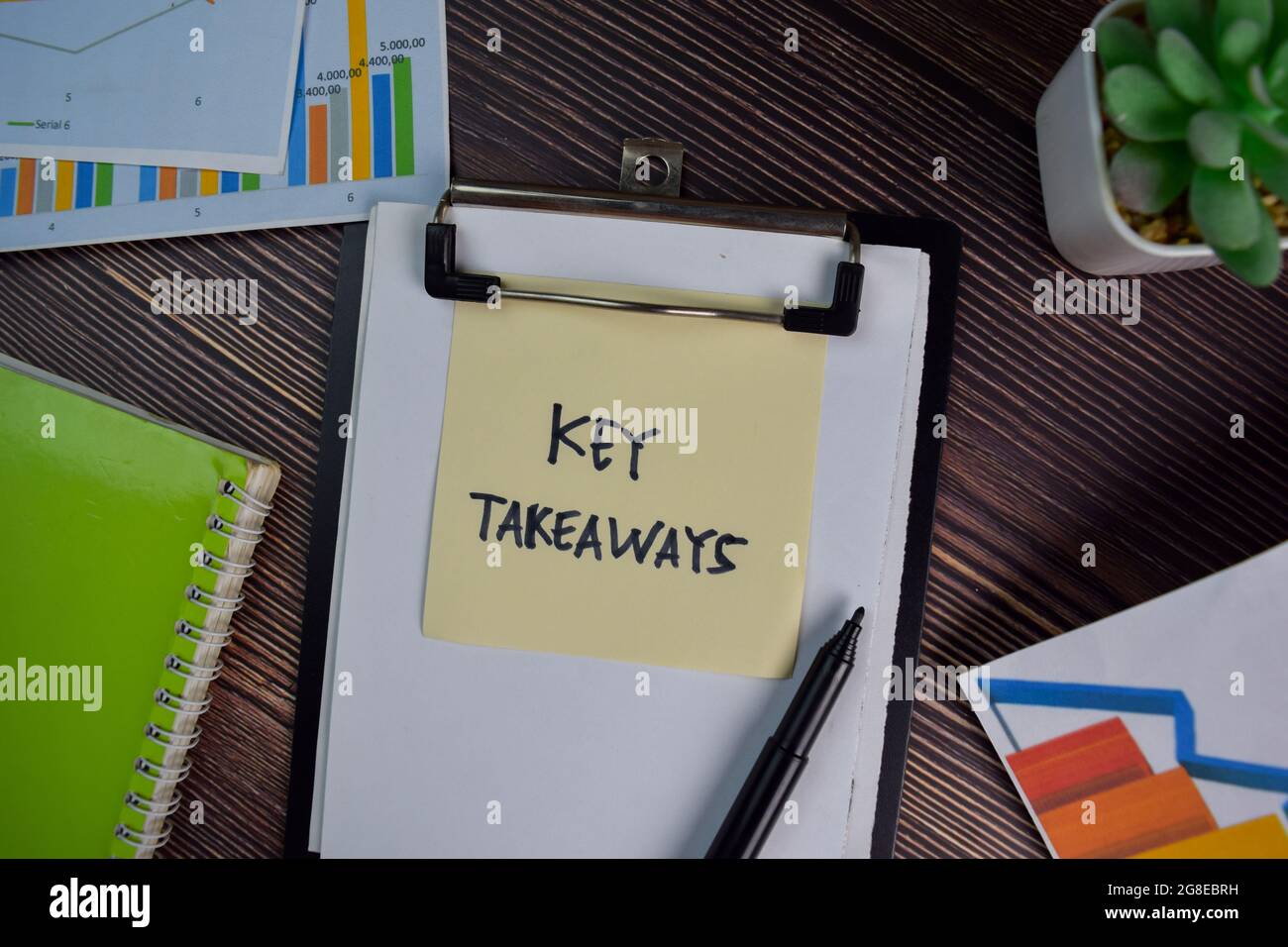 Key Takeaways write on sticky notes isolated on Wooden Table Stock ...