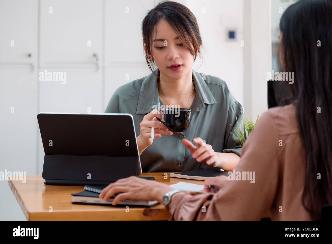 Asian business adviser meeting to analyze and discuss the situation on ...