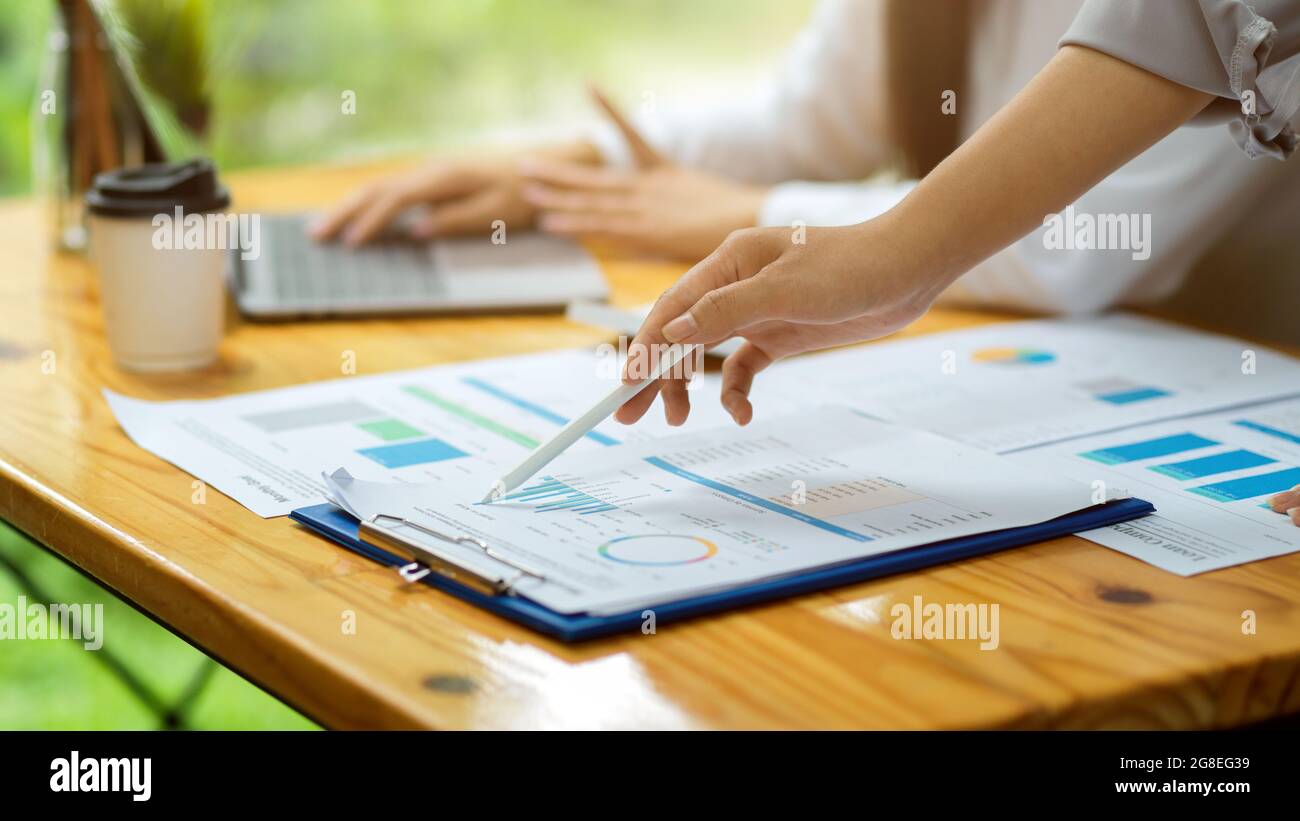 Close up hands, businesspeople talking about their financial plan and ...