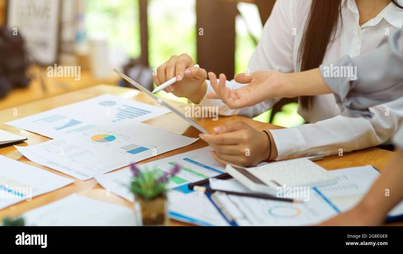 Accountant manager explain job assignment to her new intern with ...