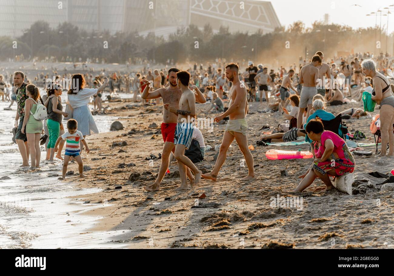 People on beach in the evening during heatwave, Park of 300th ...