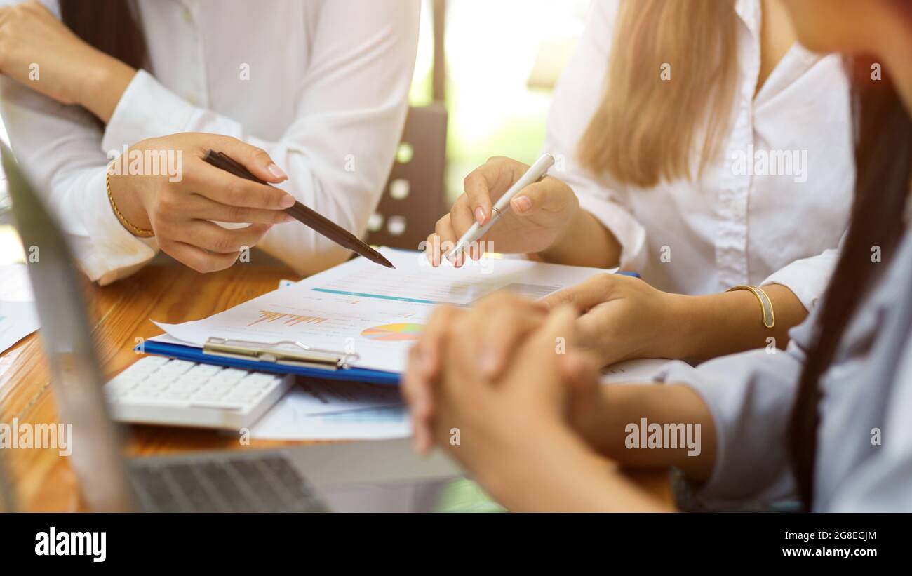 Close up professor teaching accounting to business student with ...