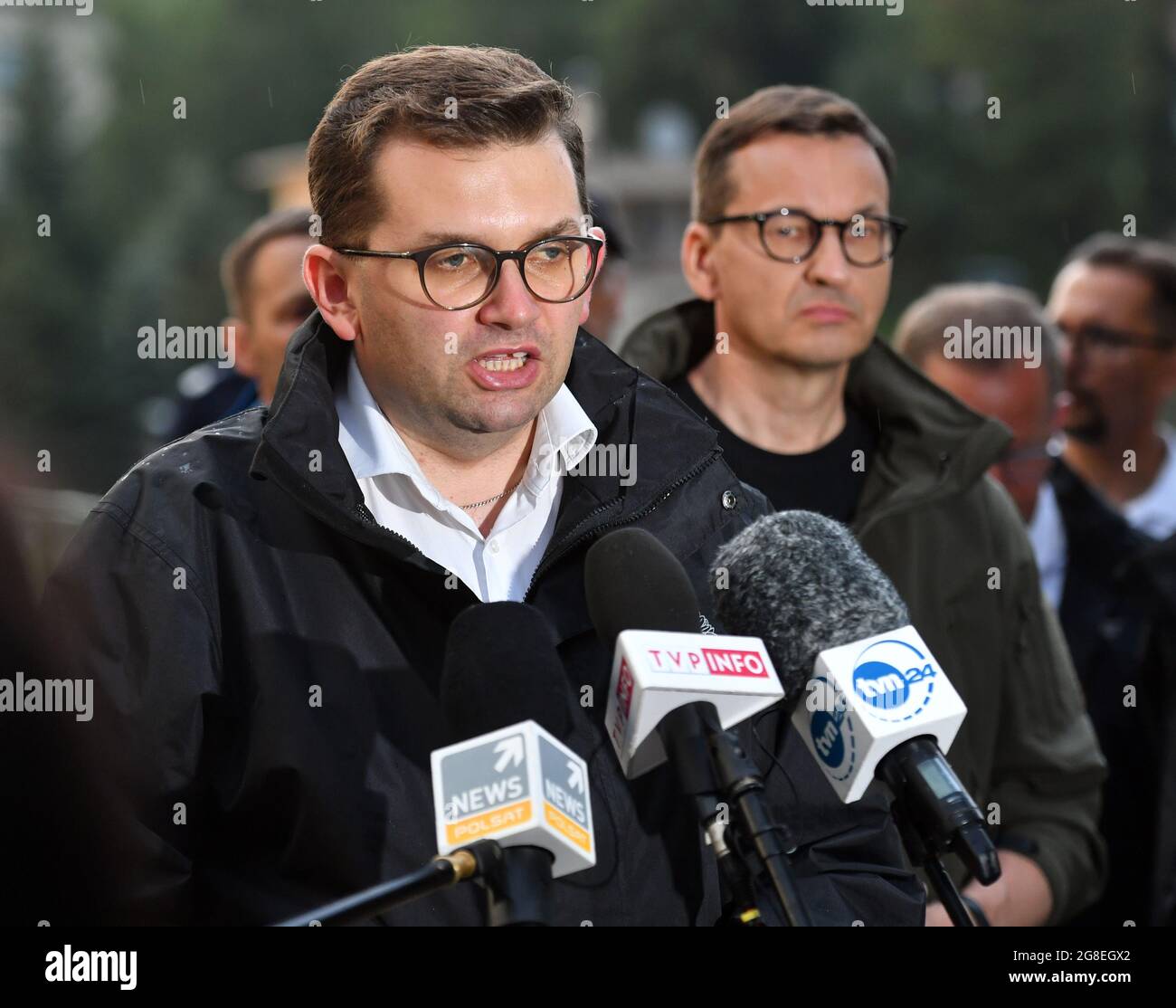 The Governor of Malopolska, Lukasz Kmita (L), speaks during a press ...