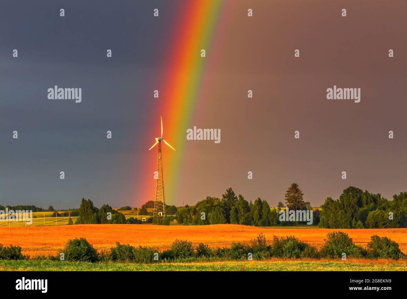 Rainbow with wind turbine, green energy concept Stock Photo - Alamy