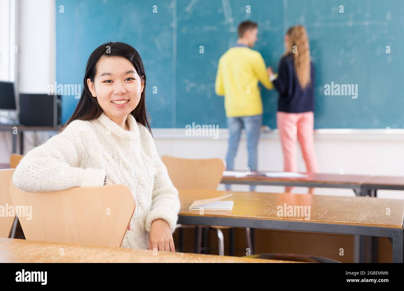 Happy Chinese girl student in classroom Stock Photo - Alamy
