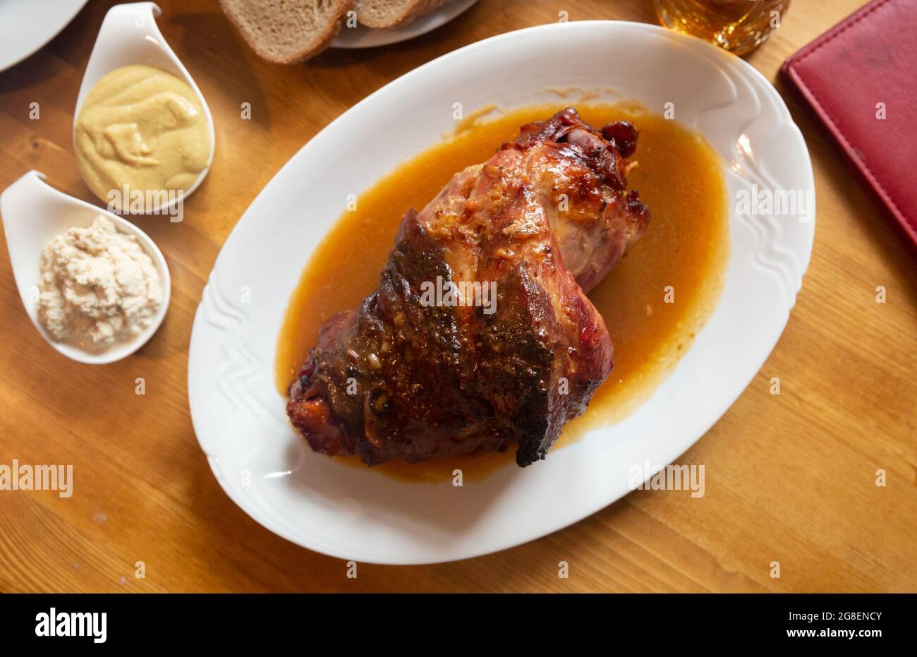 Delicious grilled knuckle of pork with horseradish and mustard Stock ...