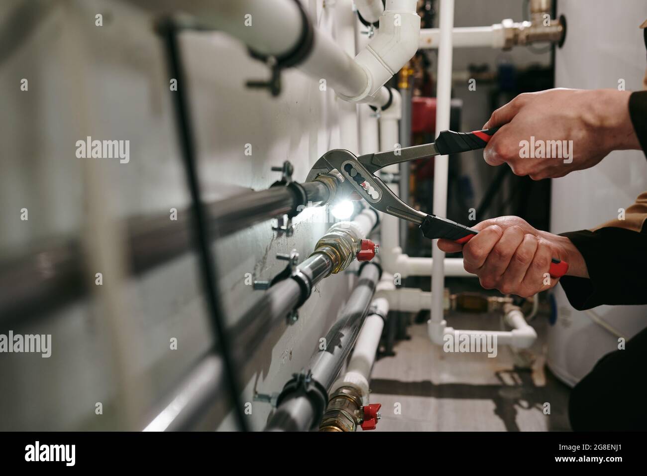 Hands of technician or plumber repairing broken pipes in toilet Stock ...