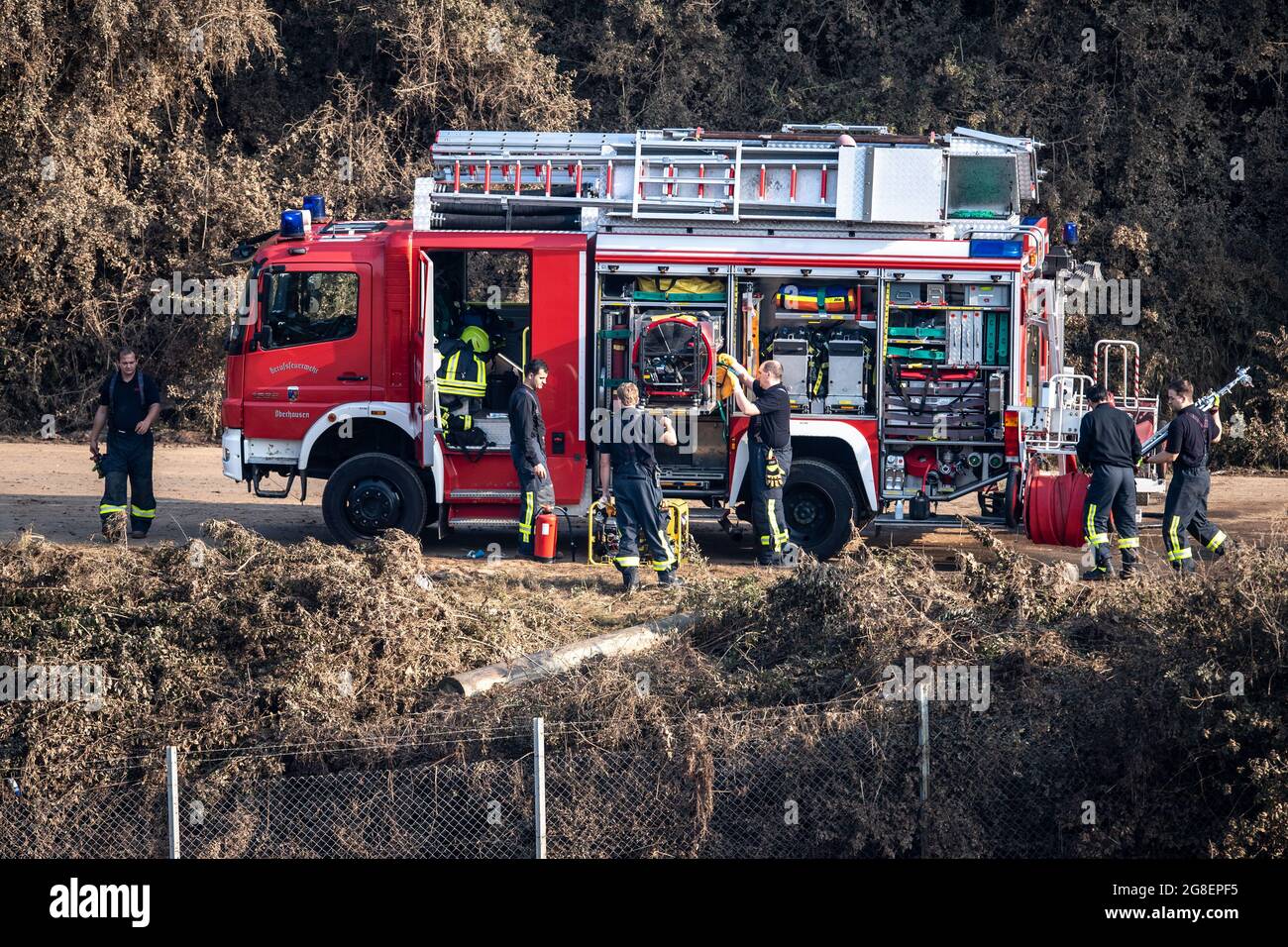 Erftstadt, Germany. 20th July, 2021. Firefighters load their vehicle ...