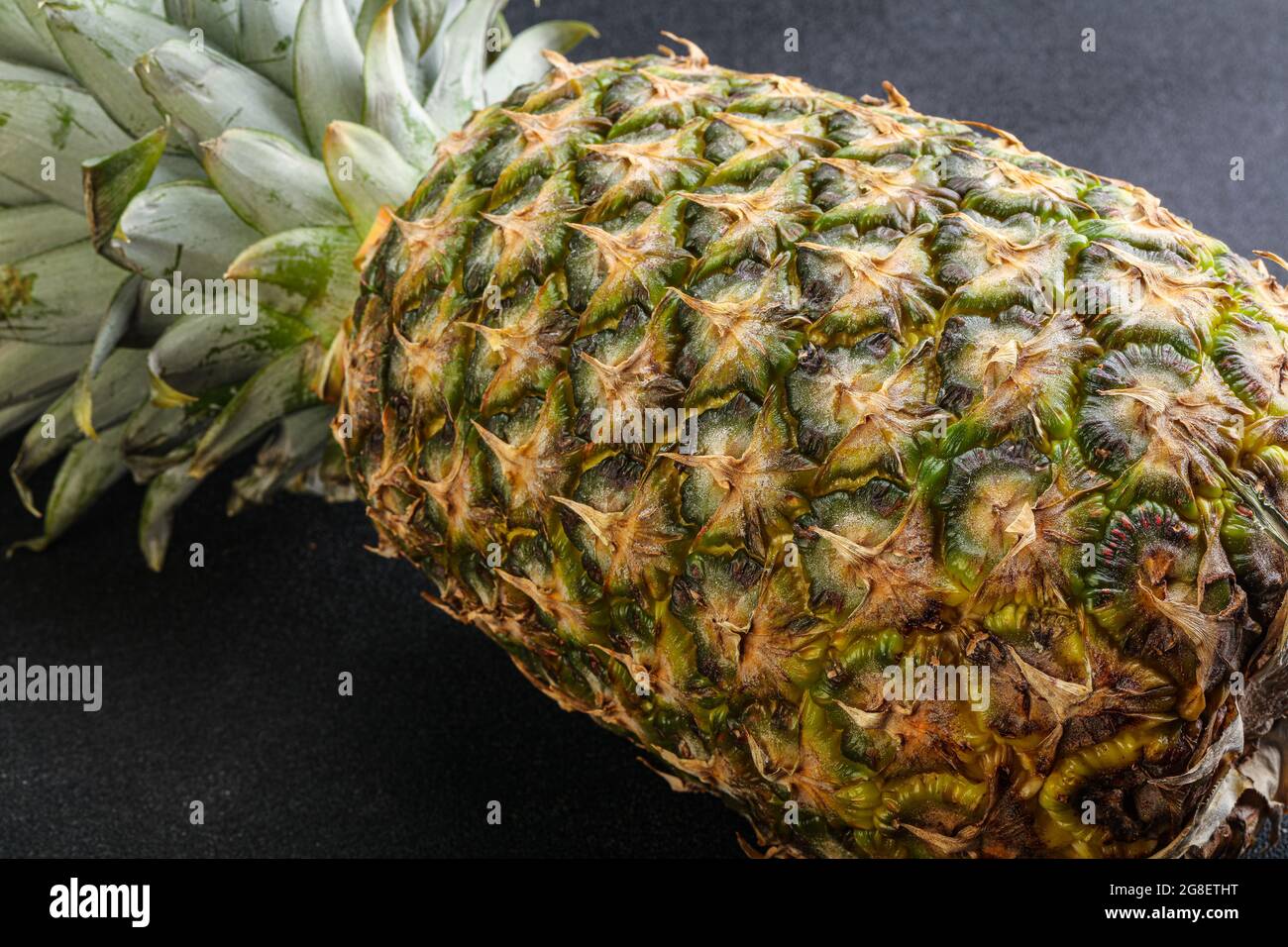 Sweet tropical ripe fruit - green pineapple Stock Photo - Alamy