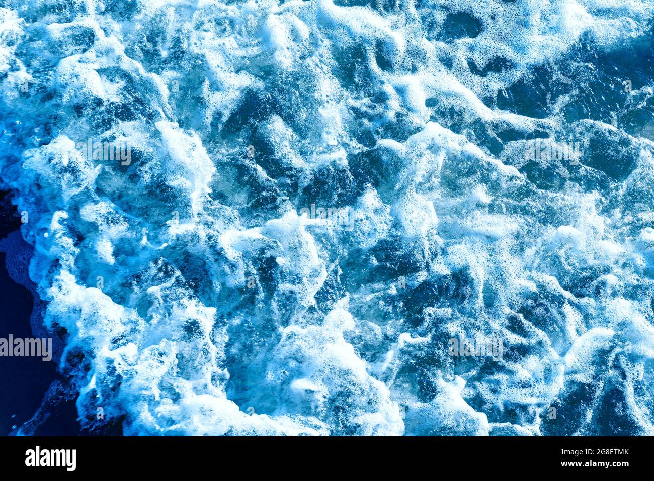 Areal shot of deep blue and rough sea with lot of sea spray.Blue ...