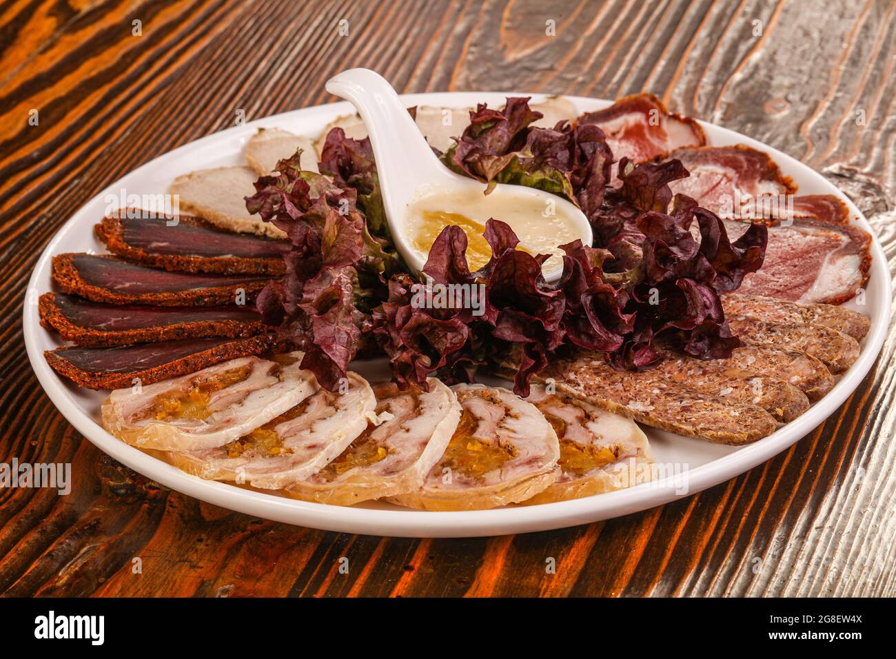 Assorted meat mix pate with mustard sauce Stock Photo - Alamy