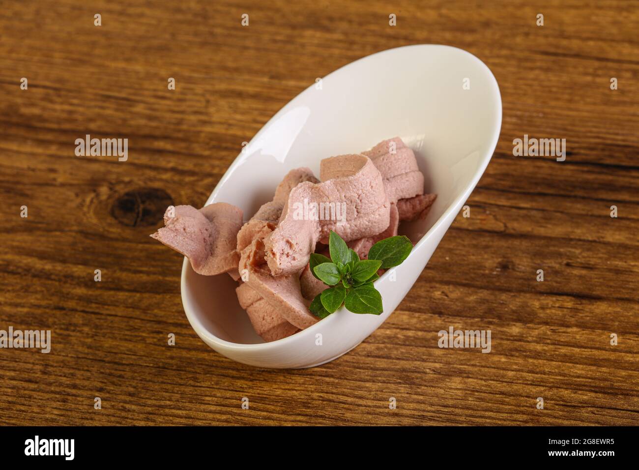 Liver pate in the bowl served basil leaves Stock Photo - Alamy