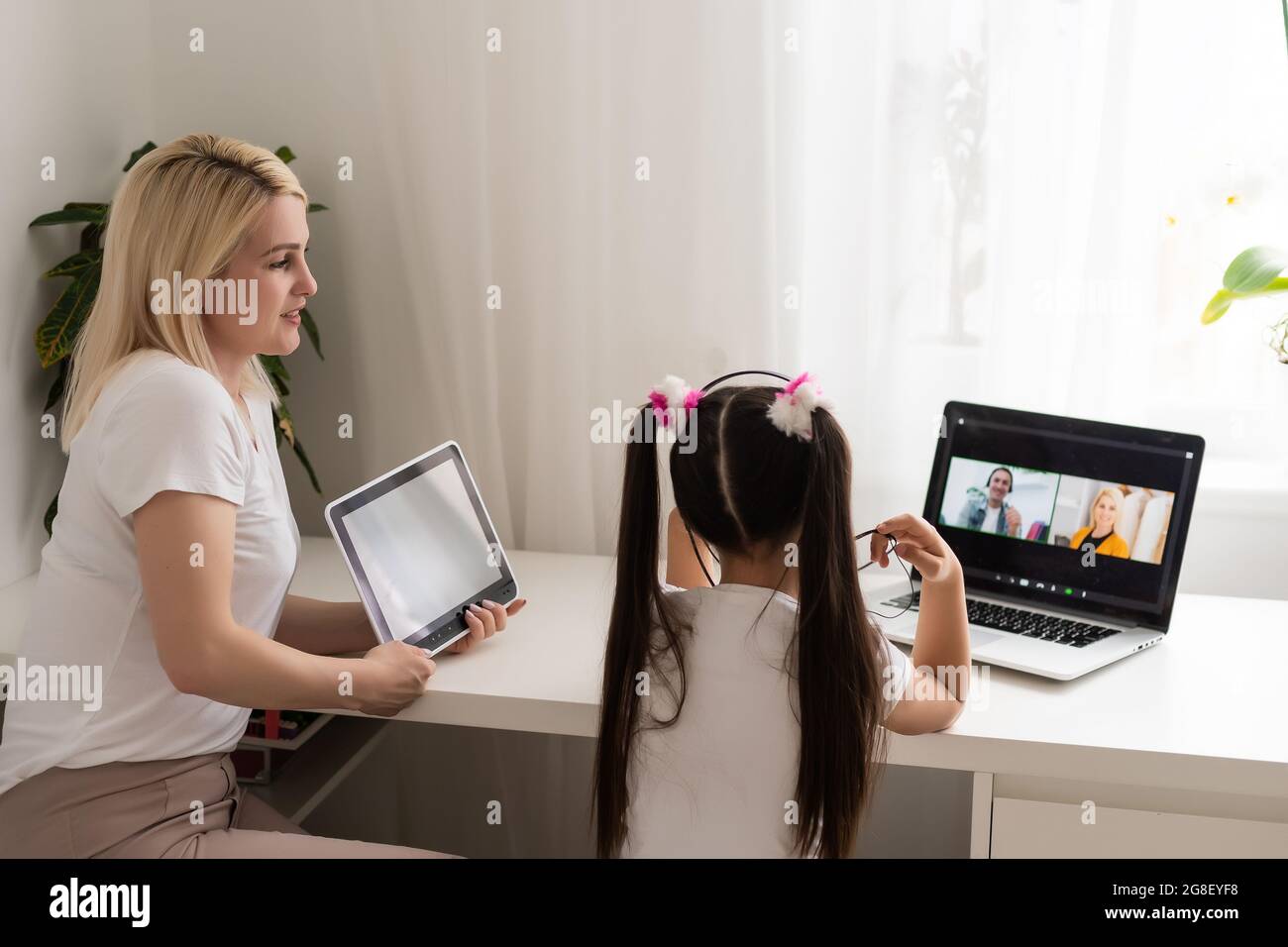 Online education of children. Mother and daughter of preschool watching ...
