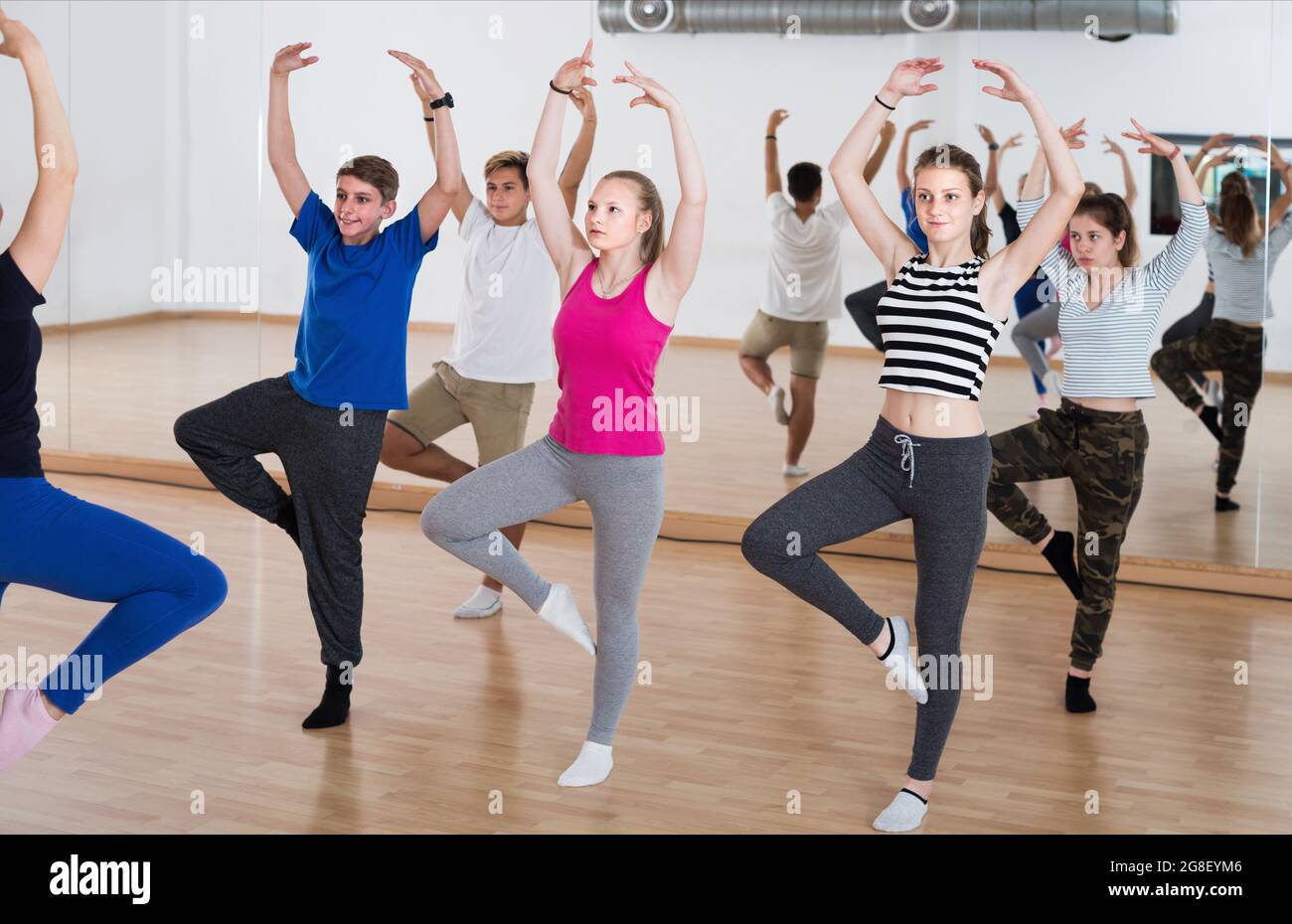 Ballet dancers trying a new position with teacher Stock Photo - Alamy