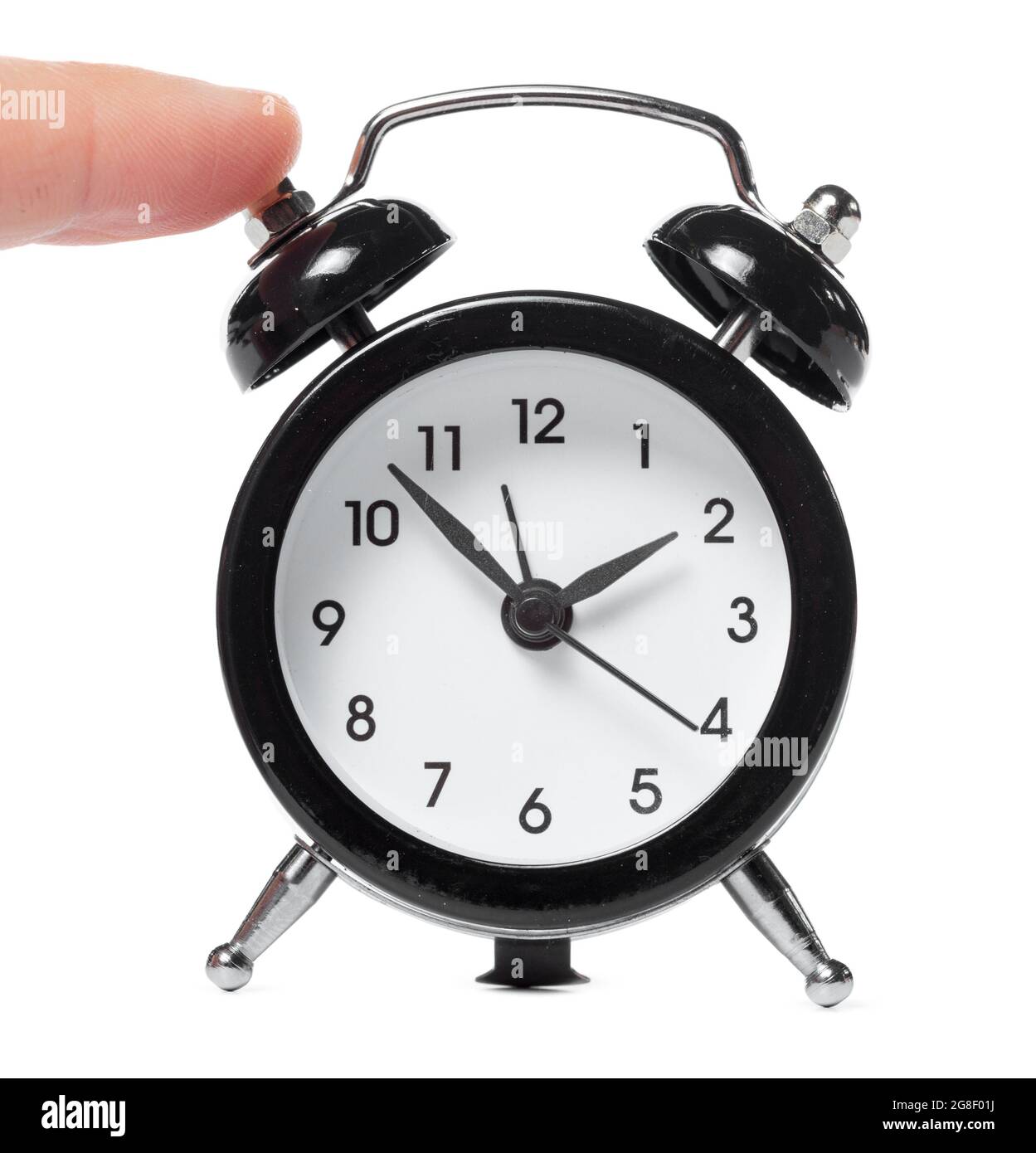 Female hand holding alarm clock on white background Stock Photo - Alamy