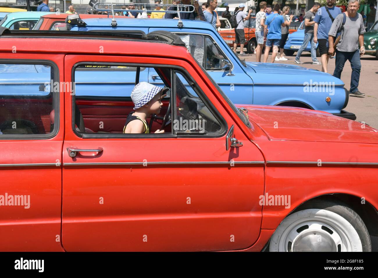KYIV, UKRAINE - JULY 17, 2021 - A child sits inside one of the 1960 ...