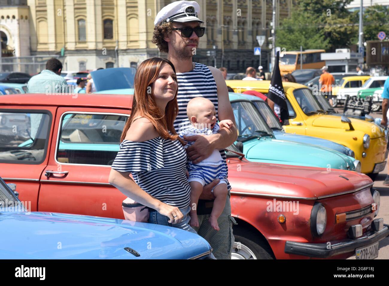 KYIV, UKRAINE - JULY 17, 2021 - A man and a woman with a baby pose for ...