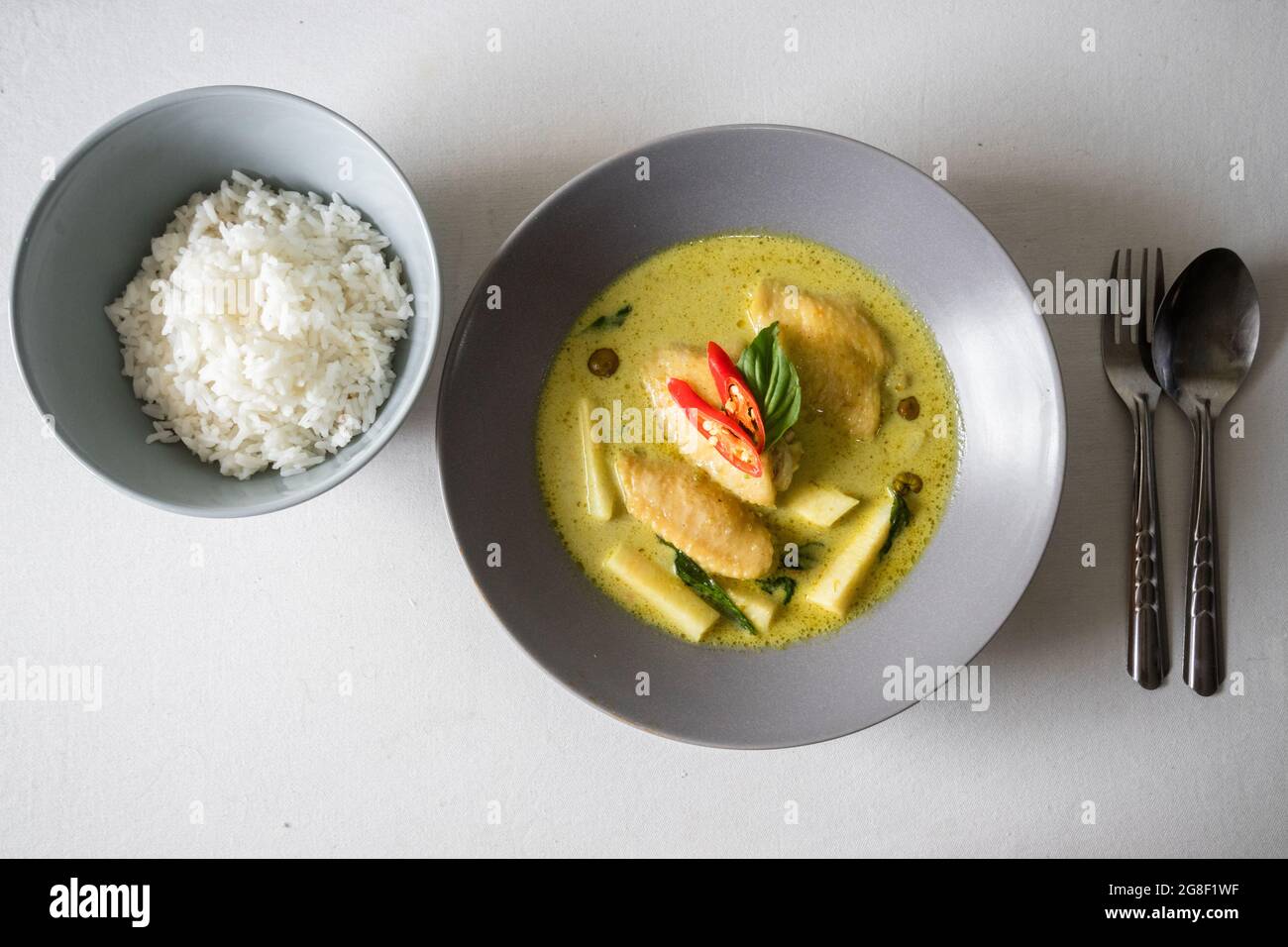 Chicken green curry with rice Stock Photo - Alamy