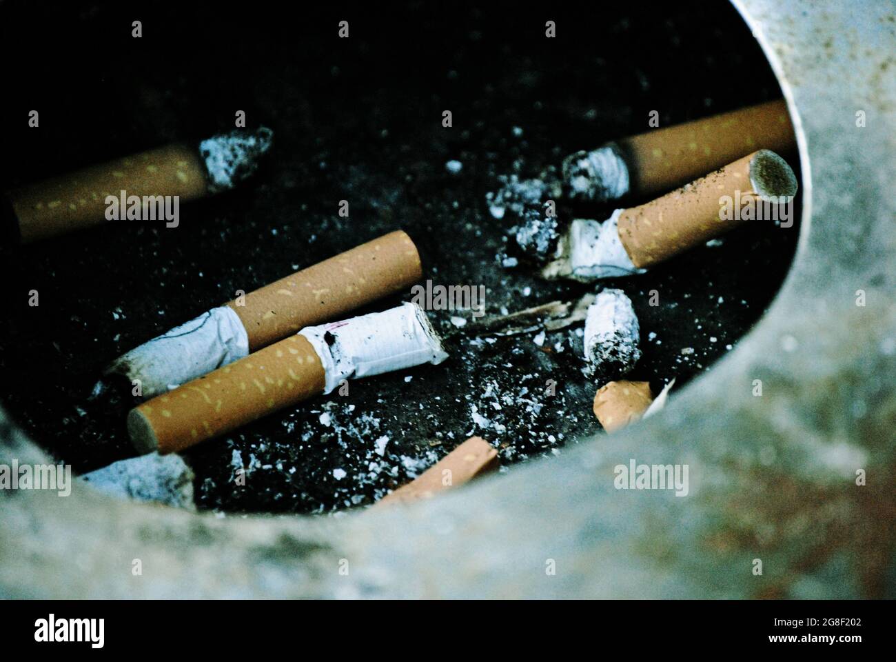 Used cigarettes in ashtray hi-res stock photography and images - Alamy
