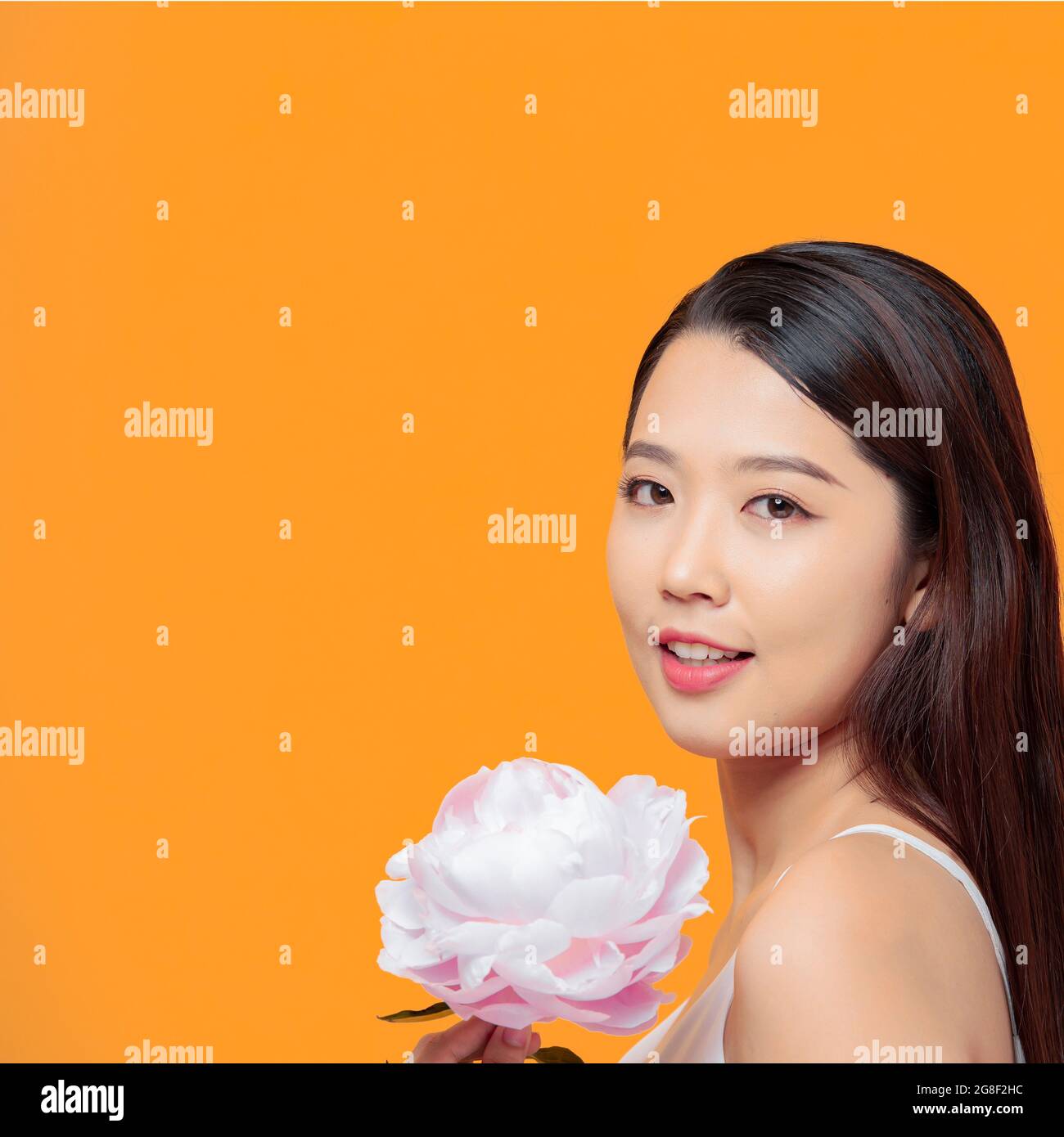 Fashion asian woman holding flower hi-res stock photography and images ...