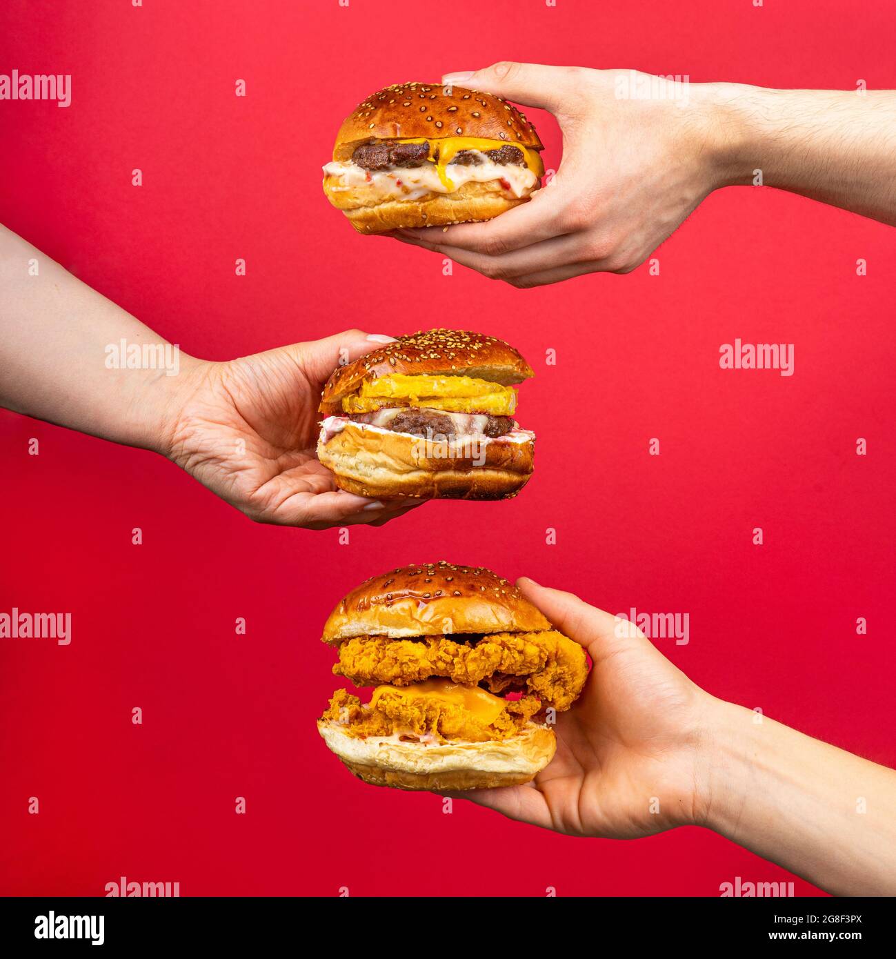 three human hands holding tasty hamburgers cheeseburger burger isolated ...