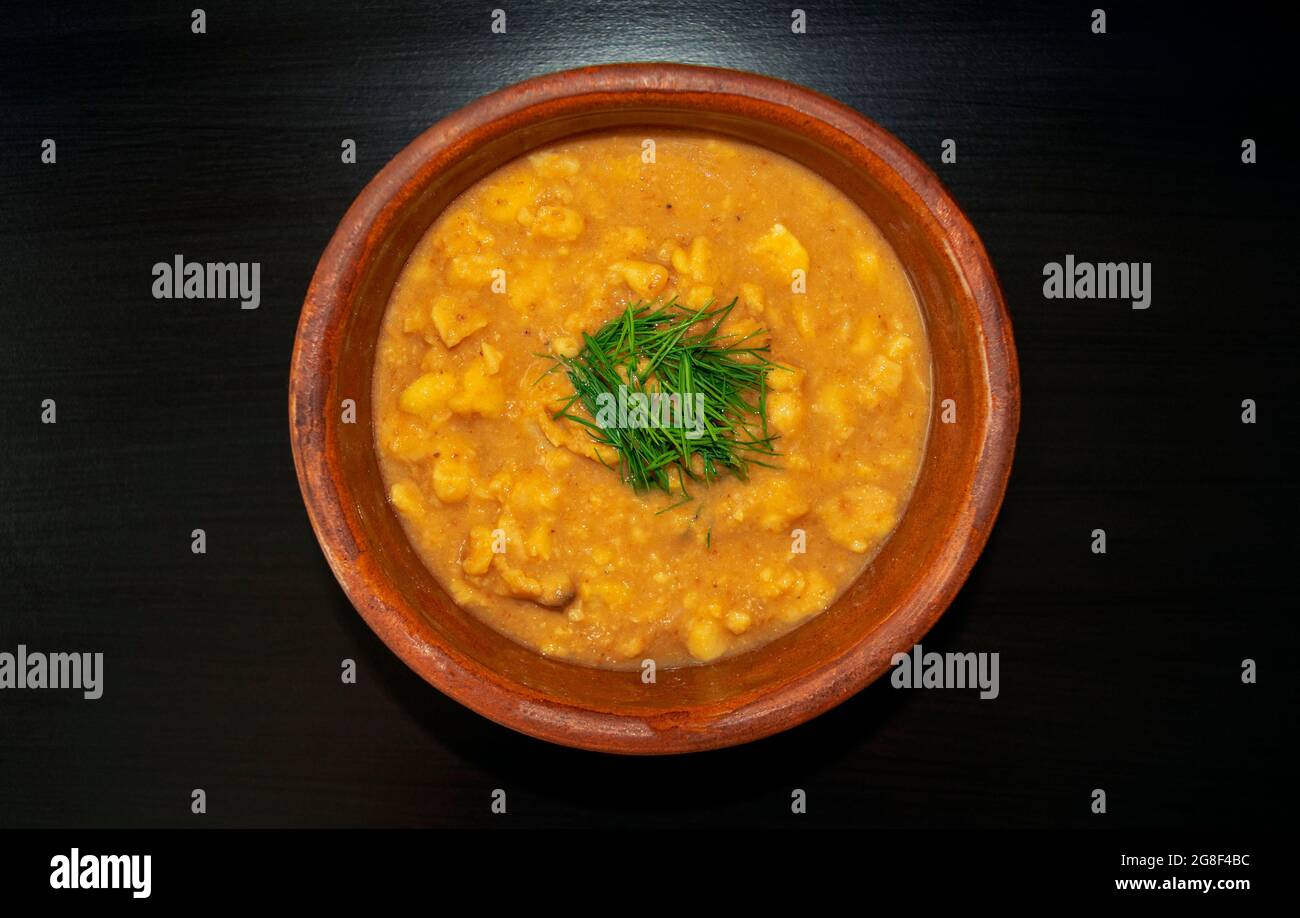 Arabic cuisine - plain peeled fava beans in a white bowl on a dark ...