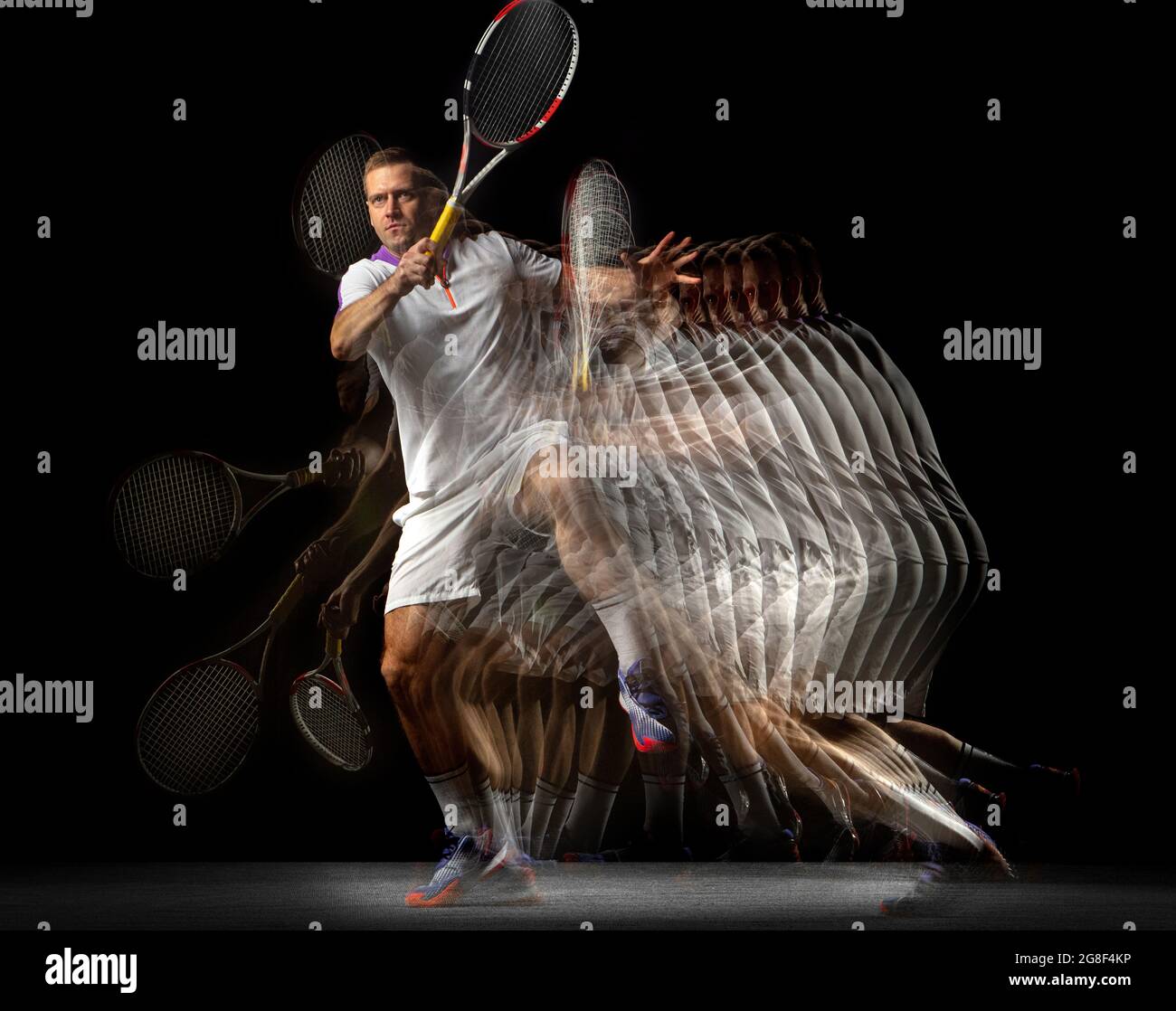 Power and speed. Young man, professional tennis player in motion and ...
