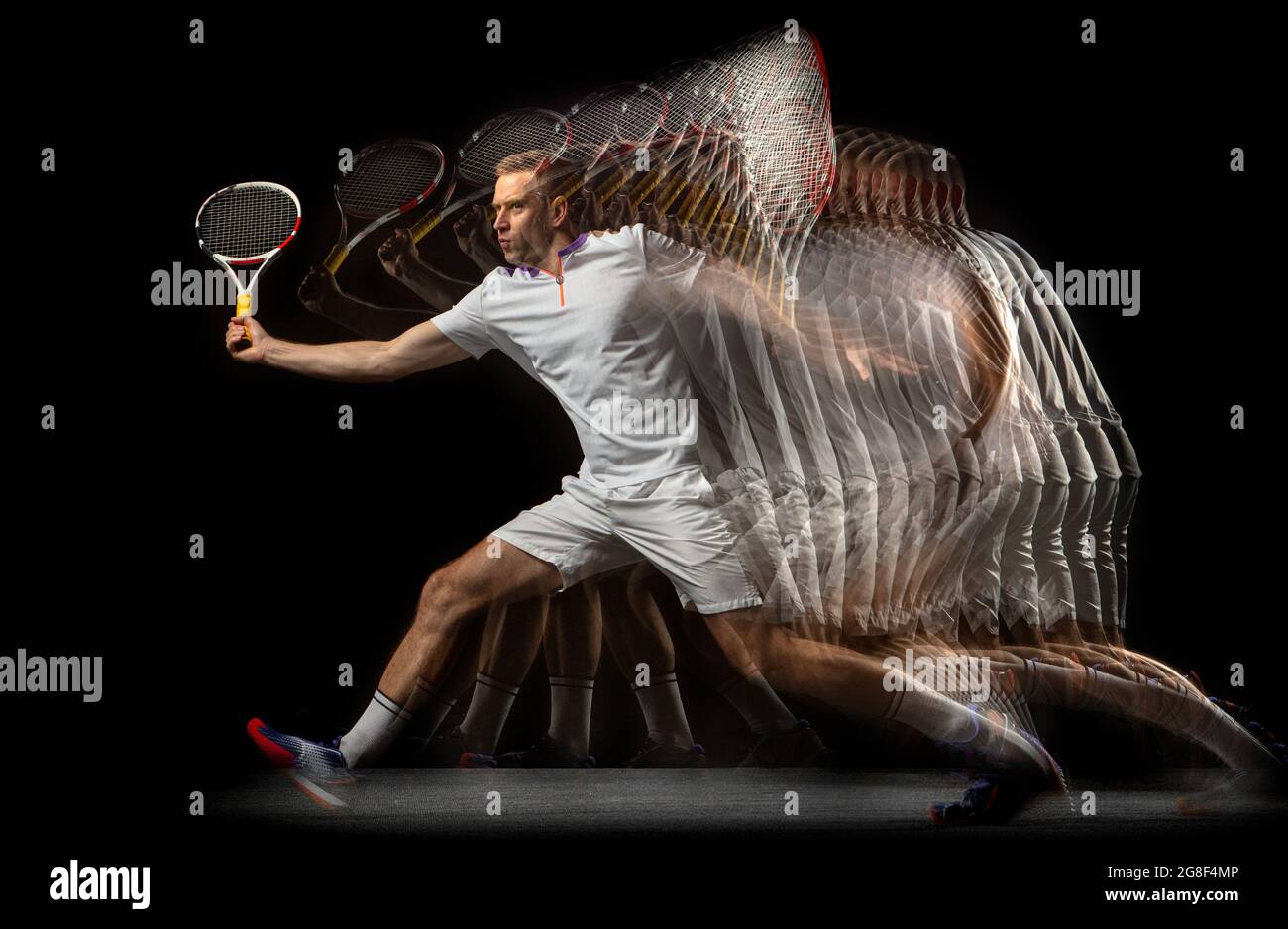 Portrait of young man, male tennis player in motion and action isolated ...