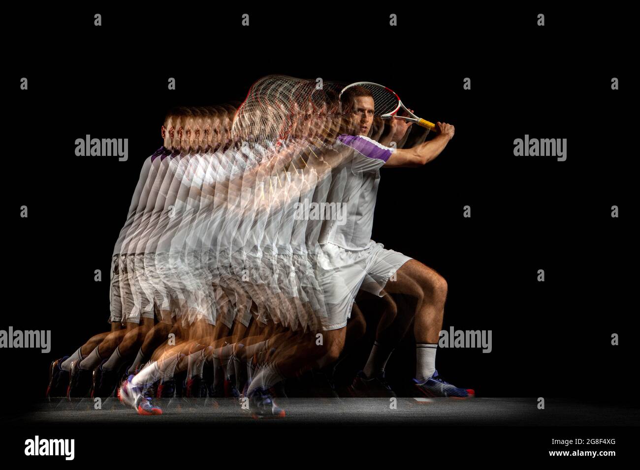 Power and speed. Young man, professional tennis player in motion and ...